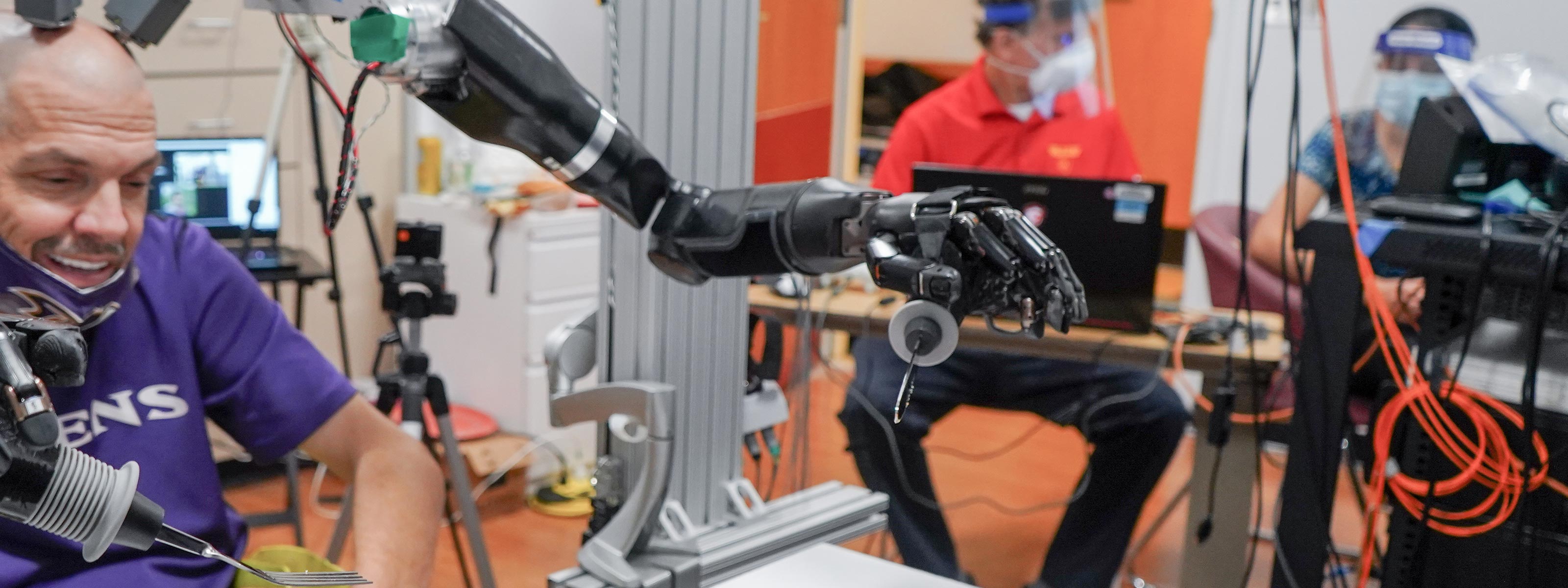 Man Moves Robot Arms With Brain Computer Interface