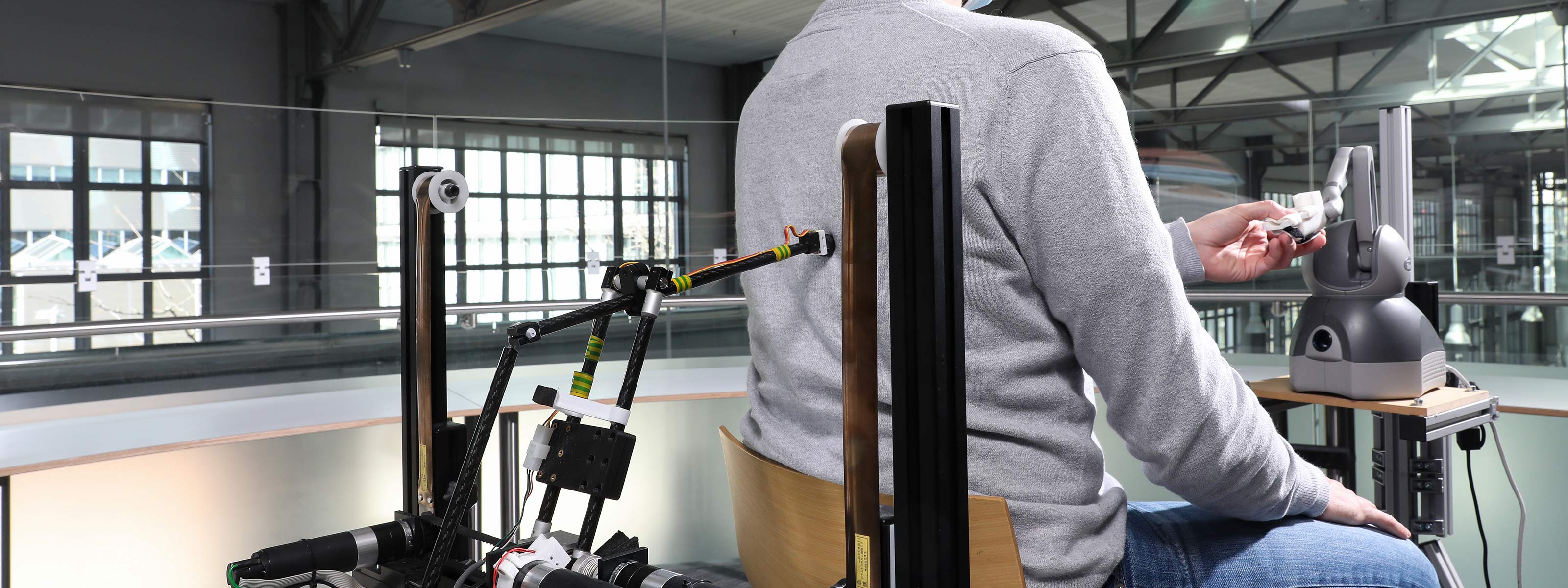 Back-poking robot triggers presence hallucinations