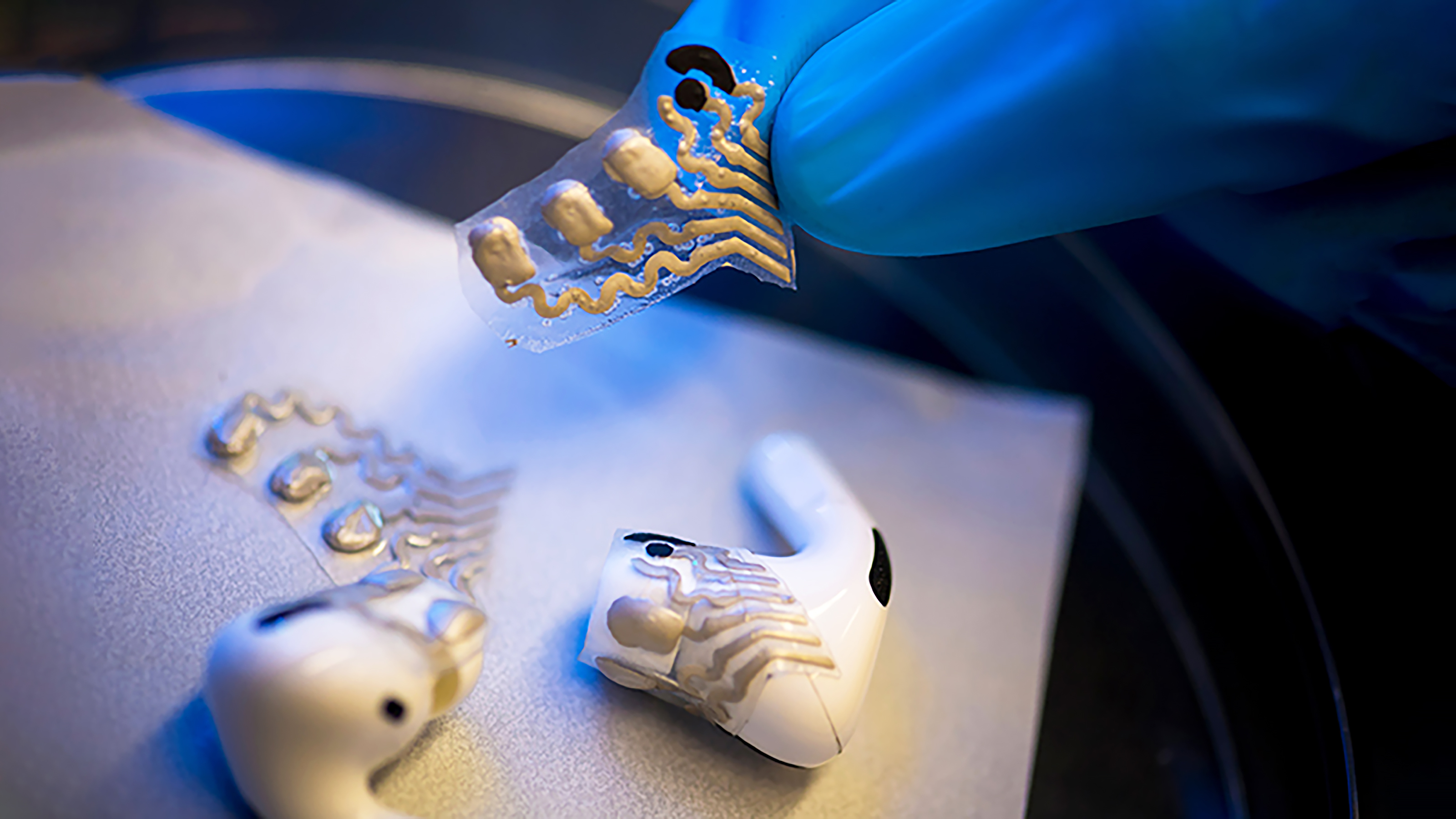 Health monitoring earbuds analyze brain activity and sweat content